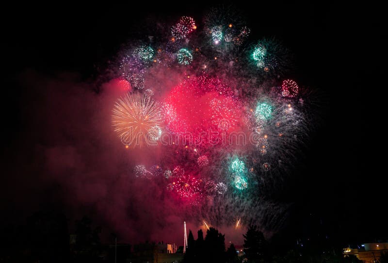 Vibrant Fireworks Display Lighting Up the Night Sky Above a Cityscape ...