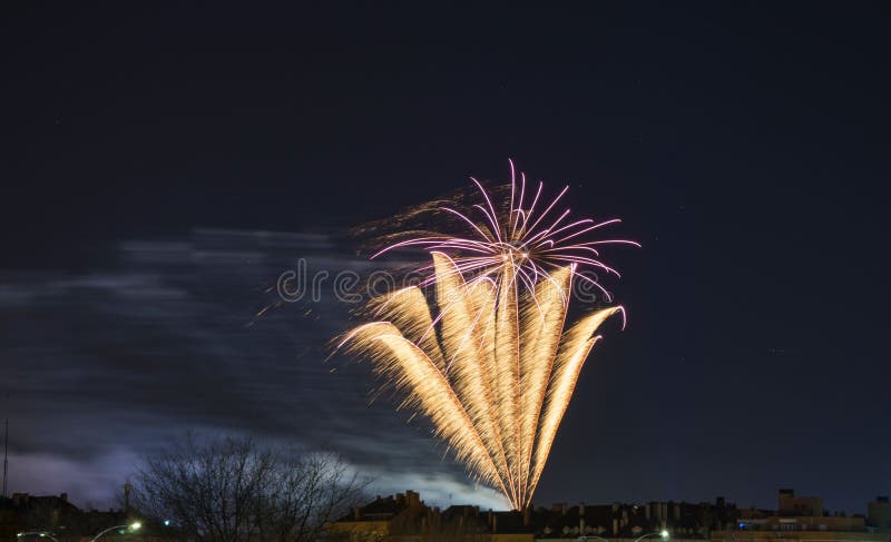 Vibrant Fireworks Illuminate the Night Sky Above a Bustling Cityscape ...
