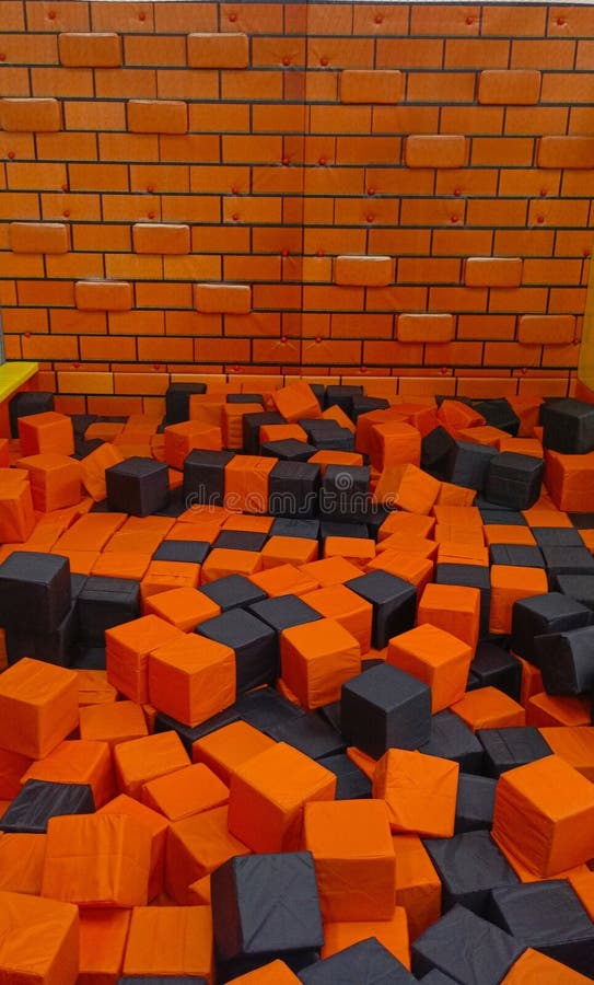 Vibrant Foam Block Play Area with Safety Padding and Industrial Wall ...