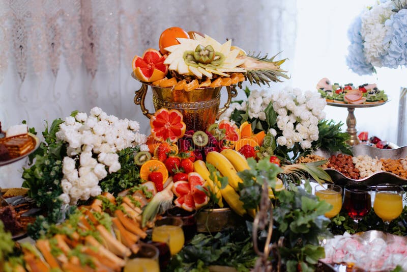 Vibrant Fruit and Flower Display at an Elegant Event Stock Photo ...