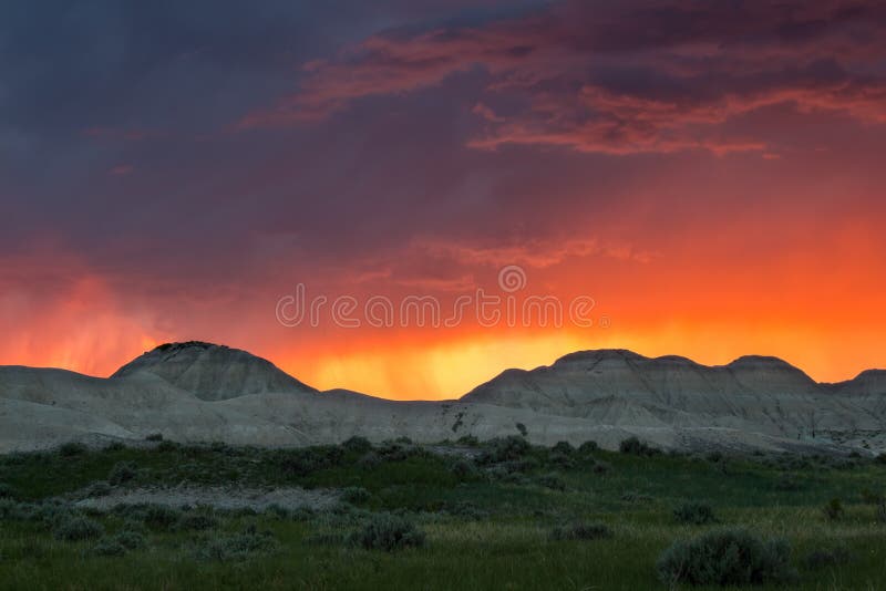 A Vibrant, Glowing Sunset Over Badlands in the Great Plains. Stock ...