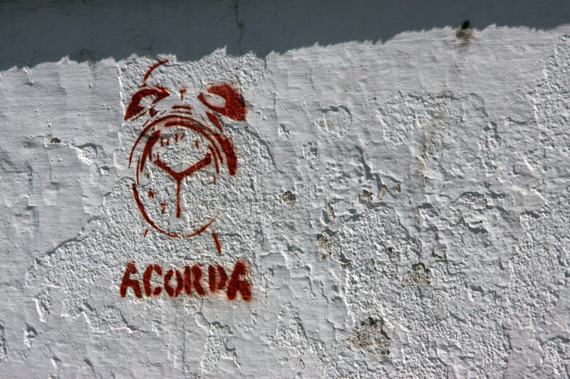 Vibrant Graffiti of an Alarm Clock with the Bold Message "Wake Up ...