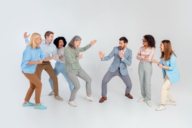 Diverse Team of Professionals Enjoying Playful Interaction in a Light ...