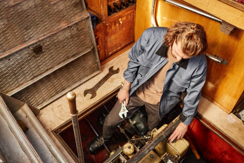 Vibrant High Angle Man Repairing Boat Engine in Docks Stock Photo ...