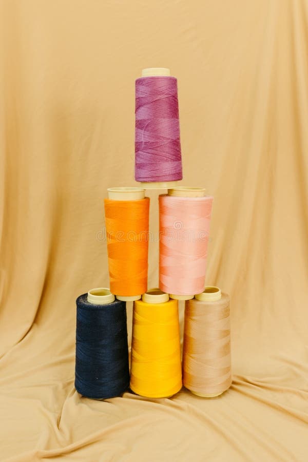 Vibrant Image of a Selection of Multi-colored Thread Spools Stacked ...