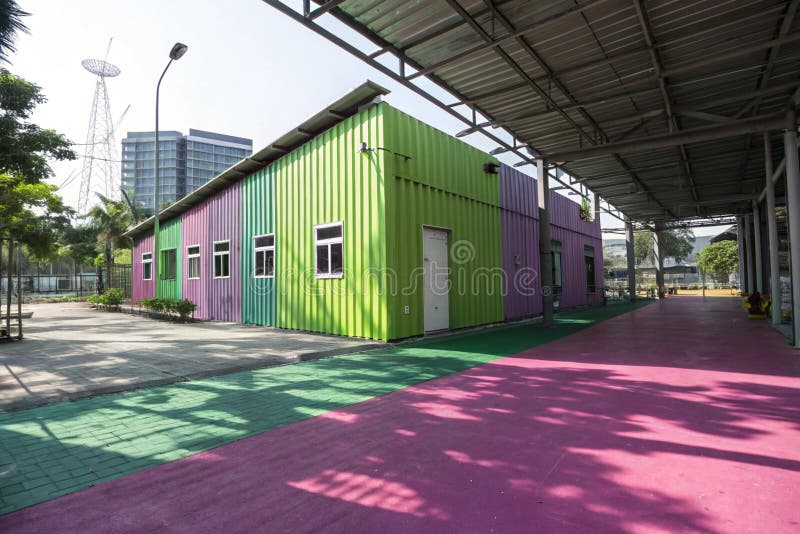 Vibrant Metal Building Casting Shadows on Textured Ground Stock ...