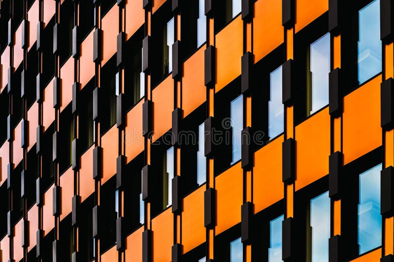 Vibrant Modern Facade with Geometric Patterns and Reflective Windows ...