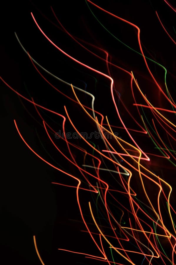 Colorful Light Trails in Abstract Patterns Against a Black Background ...