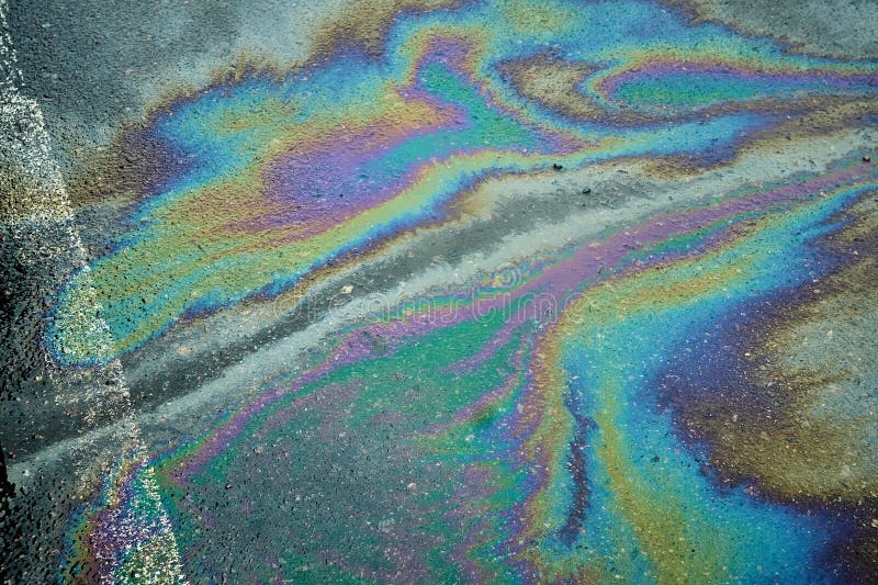 Vibrant Oil Spill Creating Rainbow Patterns on Asphalt Stock Photo ...