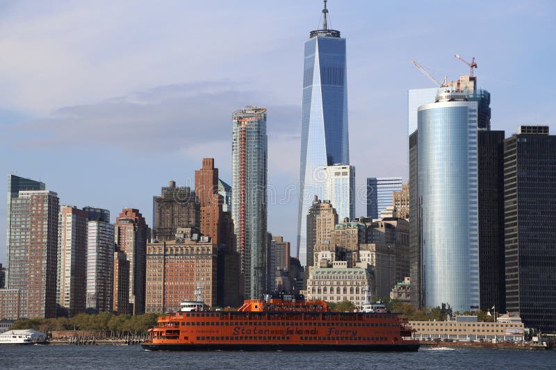 A Large Orange Ferry in Front of a High Rise Building Editorial Stock ...