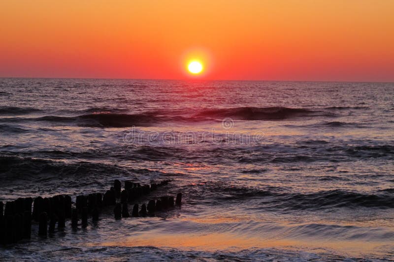 Vibrant Orange Ocean Sunset Stock Photo - Image of dusk, flow: 22440296