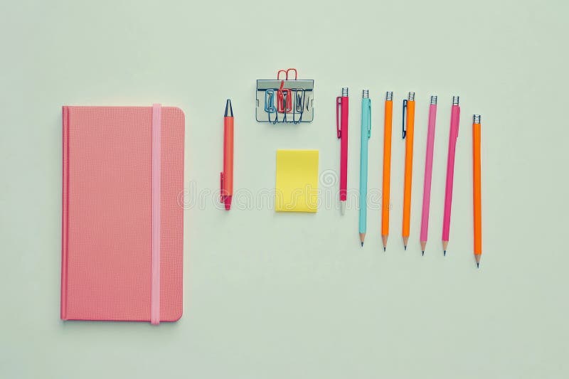 Vibrant Pens, Pencils, Paper Clips, Sticky Notes, and a Notebook Create ...
