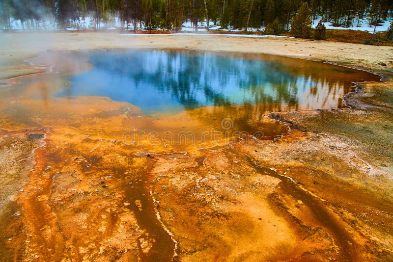 Vibrant Pools of Color in Basin of Yellowstone in Winter Stock Image ...