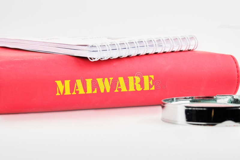 A Vibrant Red Binder Labeled Malware Sits Next To a Silver Magnifying ...