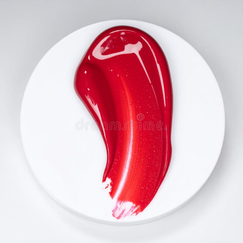 Vibrant Red Lip Gloss Smear on White Circular Surface in Bright ...