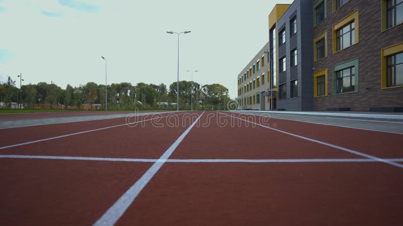 Vibrant Red Running Track with Smooth Surface at Stadium Stock Footage ...