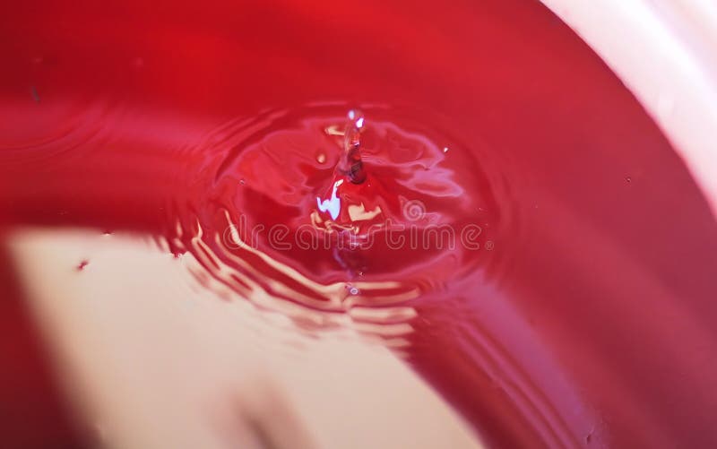 Close-Up of a Red Liquid Ripple Effect with Vibrant Abstract Patterns ...