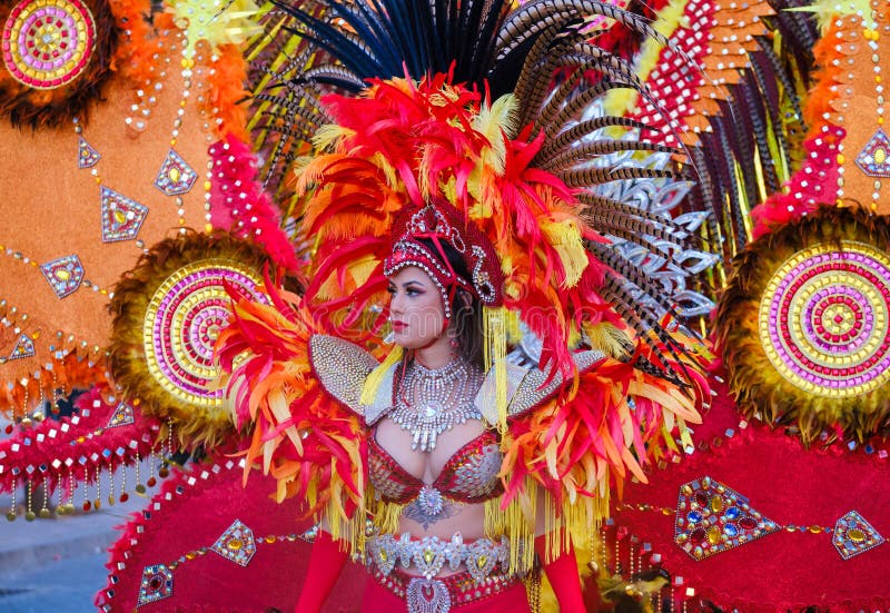 Vibrant Samba Dancer in Feathered and Beaded Costume at Carnival Parade ...