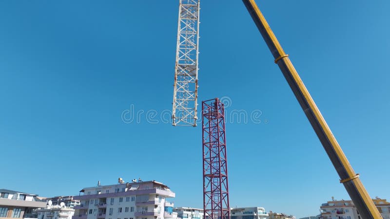 Aerial View: Professional Crane Assembly in Progress As the Operator ...
