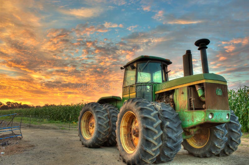 Vibrant Sky Over Farm Tractor Stock Photo - Image of vibrant, colors ...