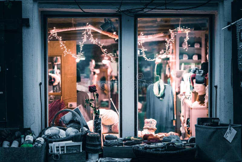 Vibrant Store-front Display at Night Illuminated with Twinkling String ...