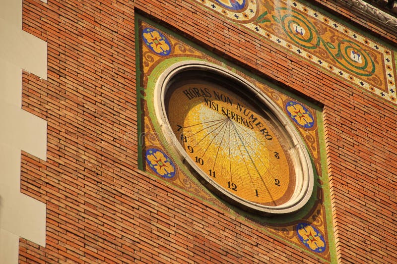 An Orange and Yellow Clock with an Outside Sun Dial on it Editorial ...