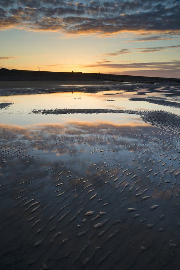 Vibrant Sunrise Landscape Reflected in Low Tide Water on Beach Stock ...