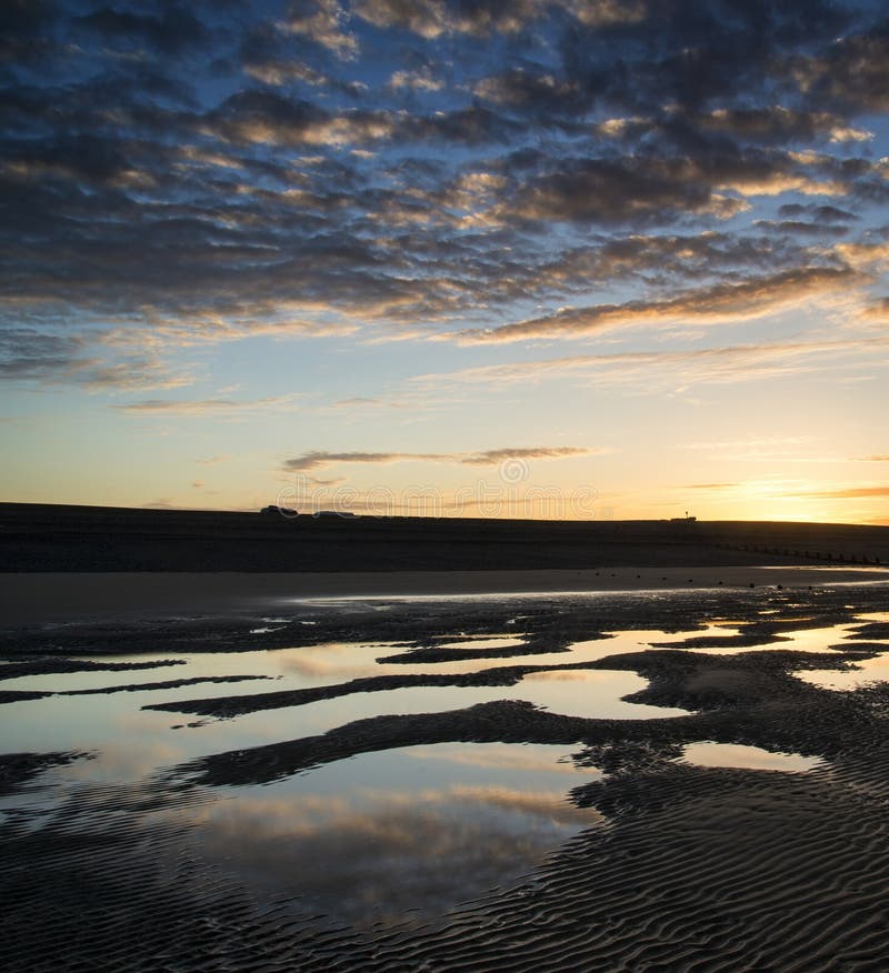 Vibrant Sunrise Landscape Reflected in Low Tide Water on Beach Stock ...