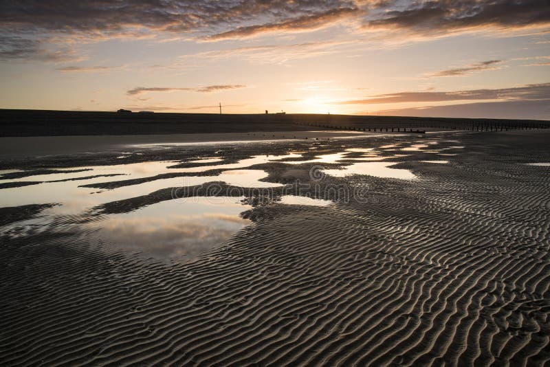 Vibrant Sunrise Landscape Reflected in Low Tide Water on Beach Stock ...