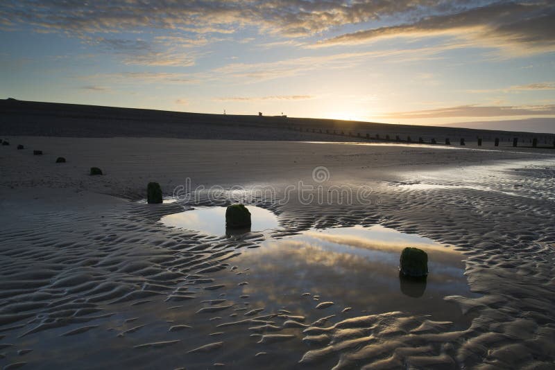 Vibrant Sunrise Landscape Reflected in Low Tide Water on Beach Stock ...