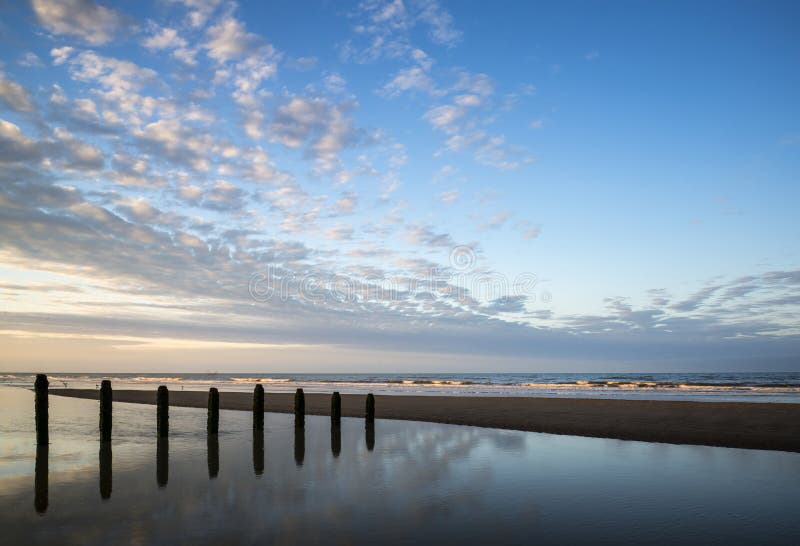 Vibrant Sunrise Landscape Reflected in Low Tide Water on Beach Stock ...