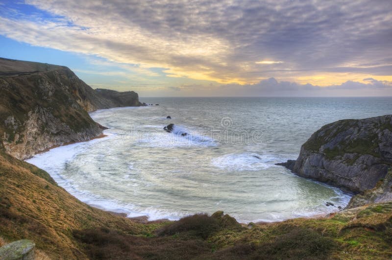 Vibrant Sunrise Over Ocean and Sheltered Cove Stock Photo - Image of ...