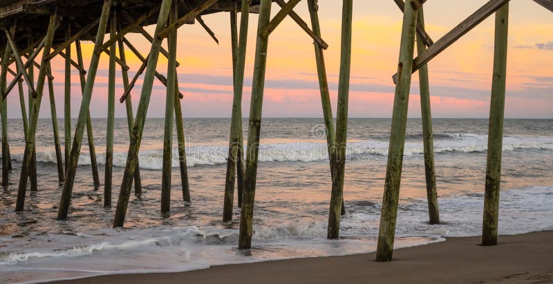 Sunset Under a Beach Pier stock image. Image of surf - 262782477