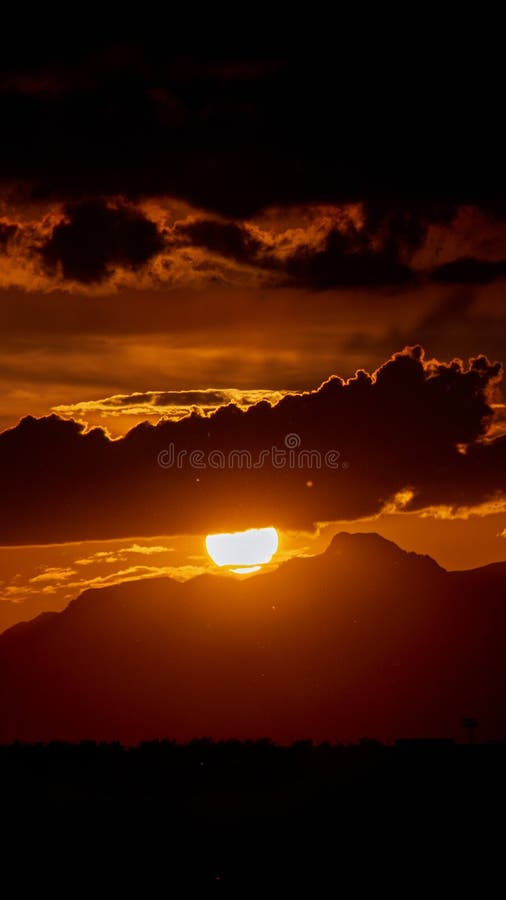 Sunset Behind Dark Clouds, Creating a Dramatic and Moody Evening Sky Scene. Stock Photo - Image ...