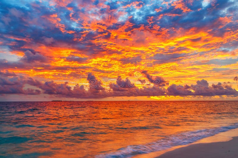 Vibrant Sunset Over Ocean on Maldives Stock Photo - Image of evening ...