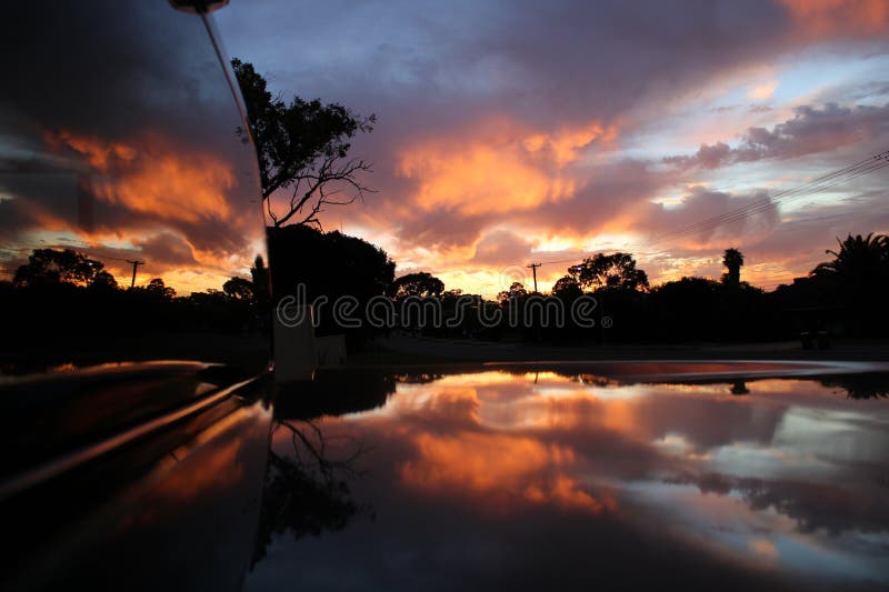 Vibrant Sunset Reflection on Car Stock Image - Image of dawn, tree ...