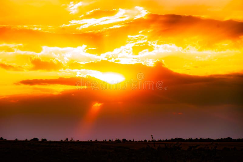 Vibrant Sunset with Sun Rays Breaking through Clouds. Dramatic Sunset ...
