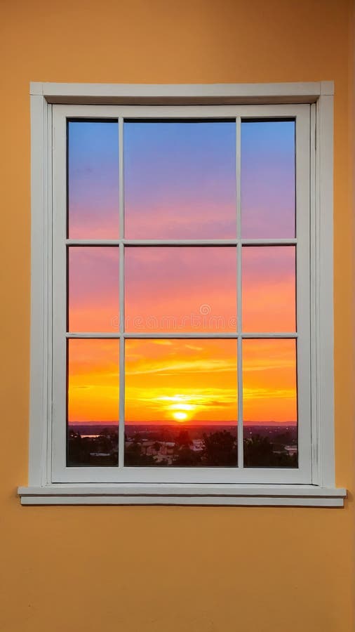 Vibrant Sunset through Window Frame with Warm Orange Sky Stock Photo ...