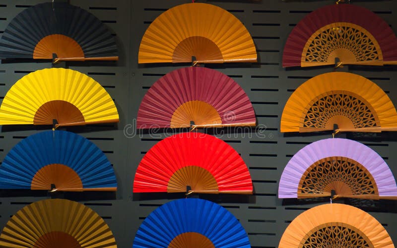 Vibrant Wall Display Showcasing an Array of Vivid Multicolored Fans ...
