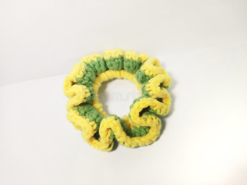 A Vibrant Yellow and Green Crochet Scrunchie with a Ruffled Texture ...