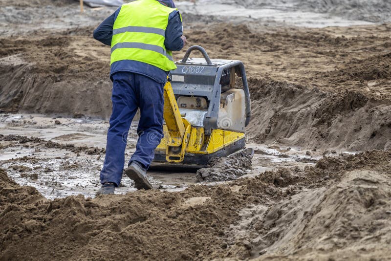 Vibrating Machine Compacting Soil Stock Photo - Image of renovation ...