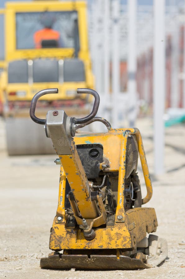 Vibrating Plate Compactor at Construction Site Stock Photo - Image of ...