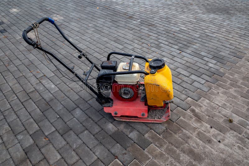 Vibrating Plate Compactor Machine at a Construction Site. Equipment for ...