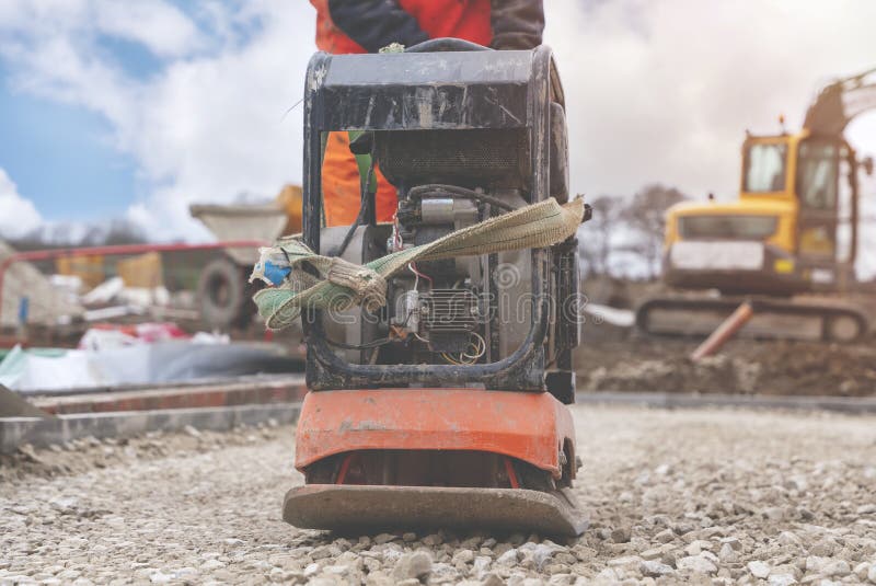 Vibrating Plate Compactor Osed To Compact Ground and Stone on Building ...