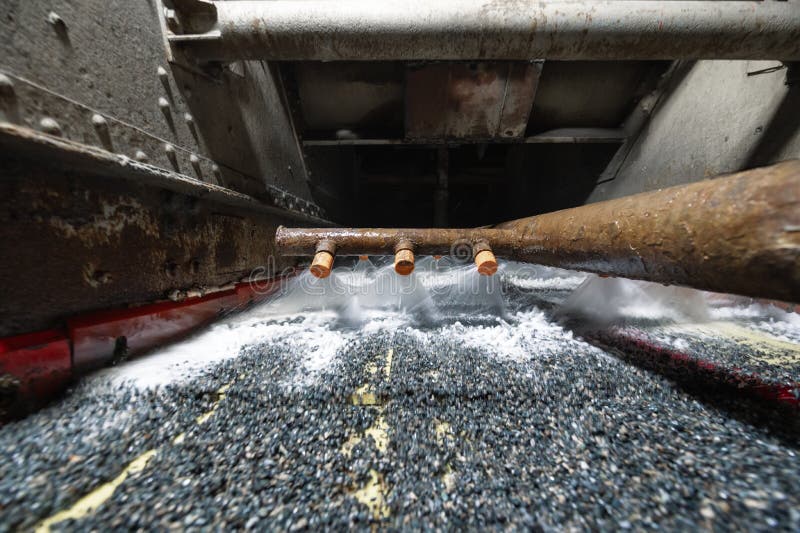 Vibrating Screen, Ore Washing with Liquid. Lots of Small Stones on the ...