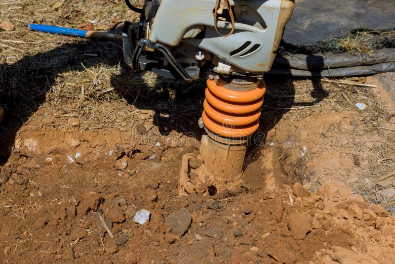 The Vibration Plate from a Tamping Machine Compactor Tool Jumps at the ...