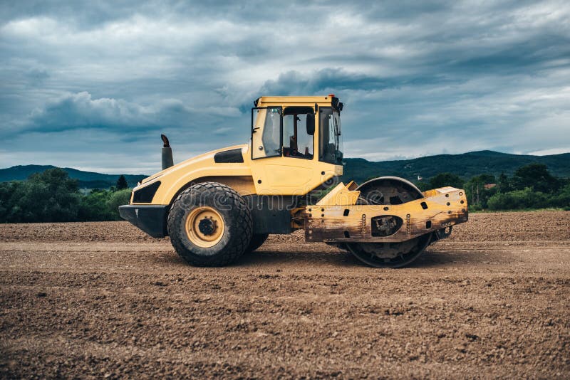 Vibration Roller Compactor Working on Highway Ground Construction Site ...