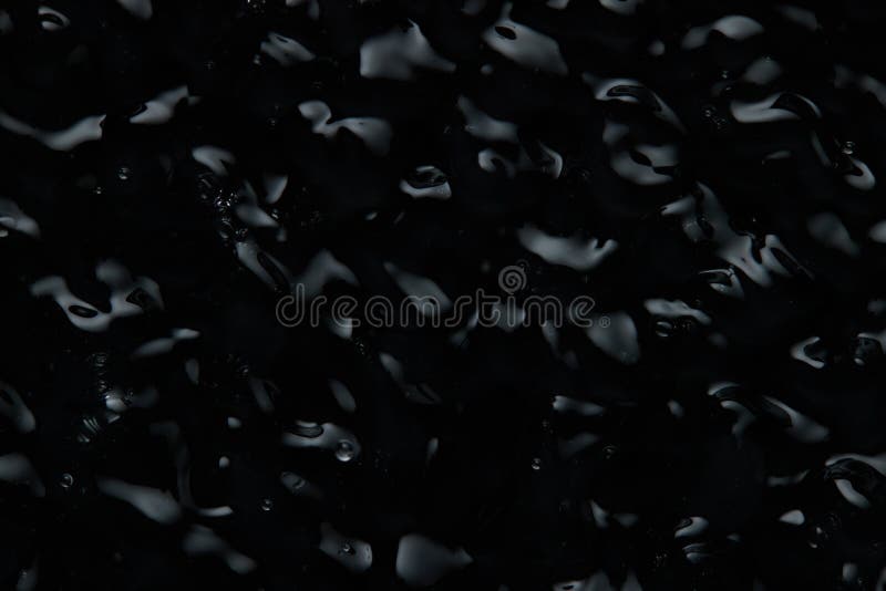 Vibration on the Surface of the Liquid. Abstract Black Background ...