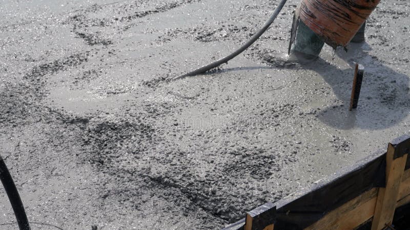 Vibration Work with Liquid Concrete at the Construction Site. Concrete ...