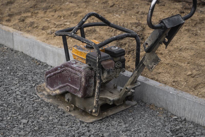 Vibrational Paving Stone Machine for Finish on a Sidewalk Road ...